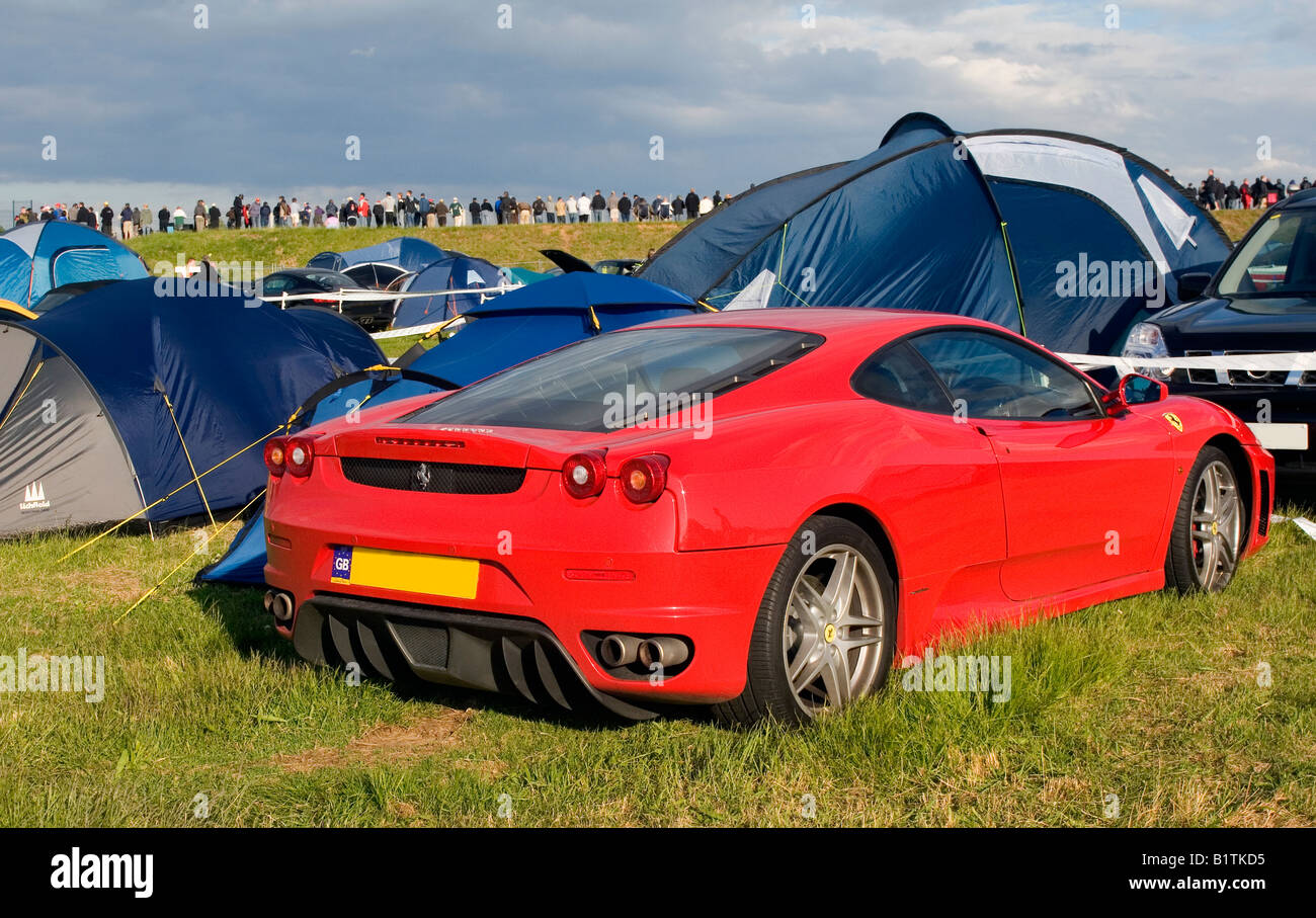 Red Ferrari 430, parked next to tents on camping site at Le Mans, June ...