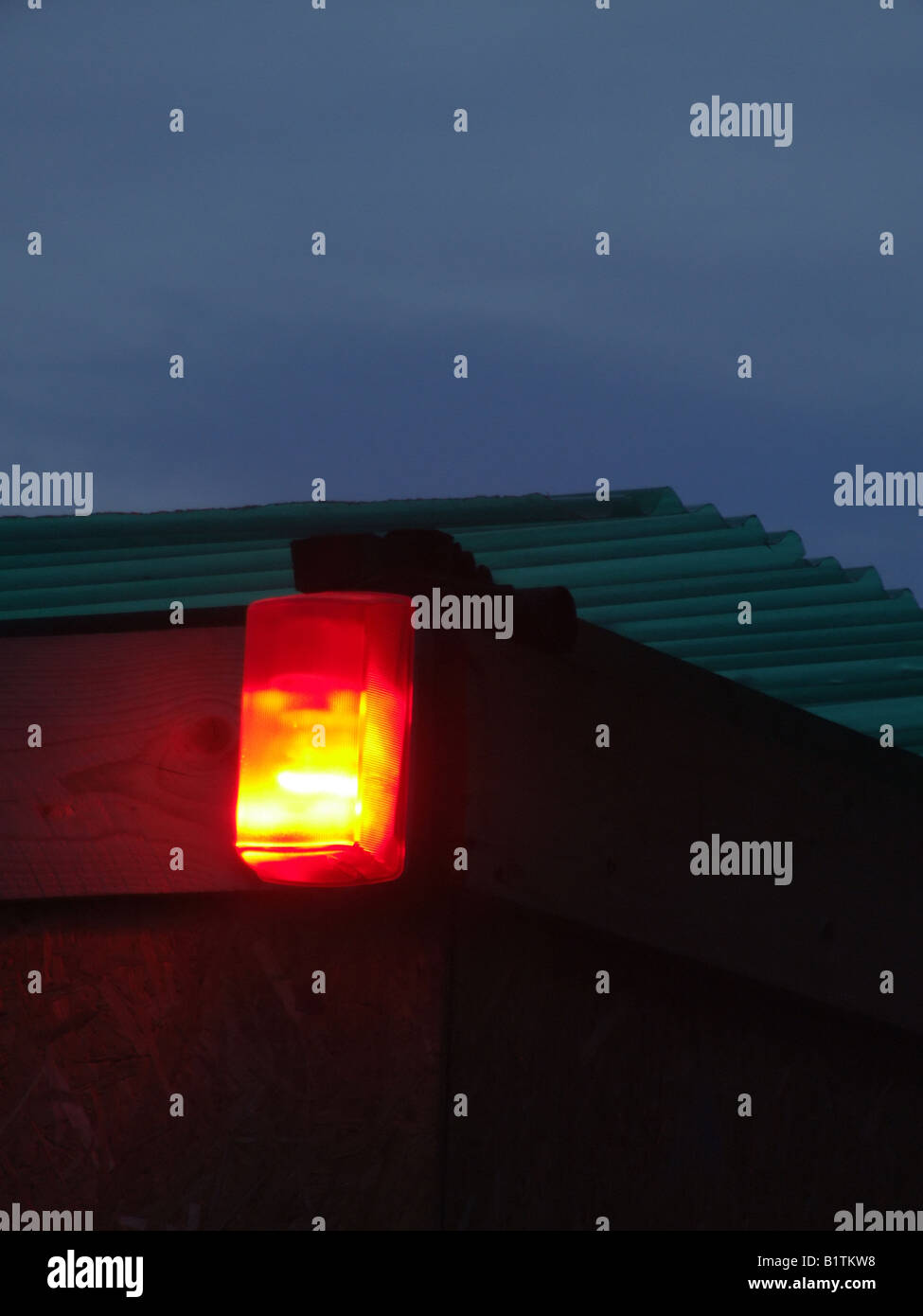 one security light on building at night Stock Photo - Alamy
