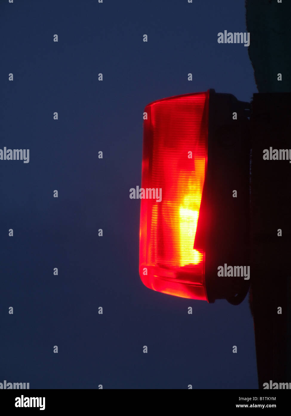 one security light on building at night Stock Photo - Alamy