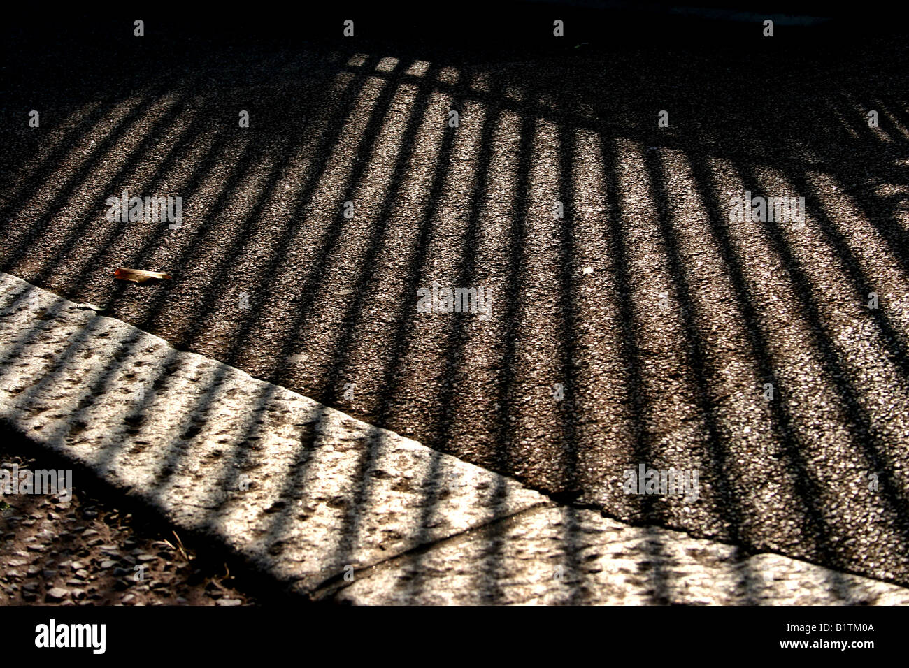 Sun through railings Stock Photo - Alamy
