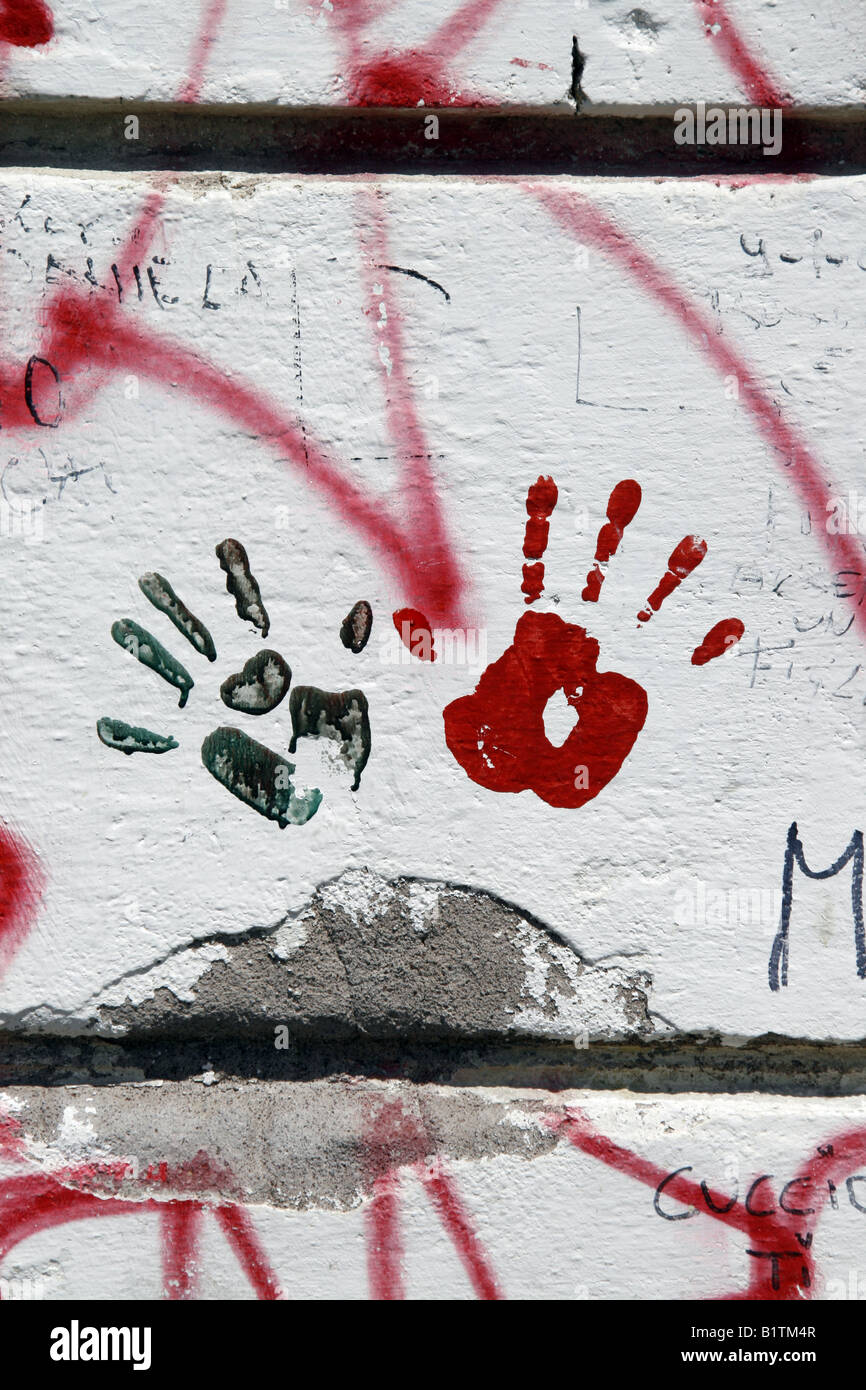 hand print painted graffiti on wall in town Stock Photo - Alamy