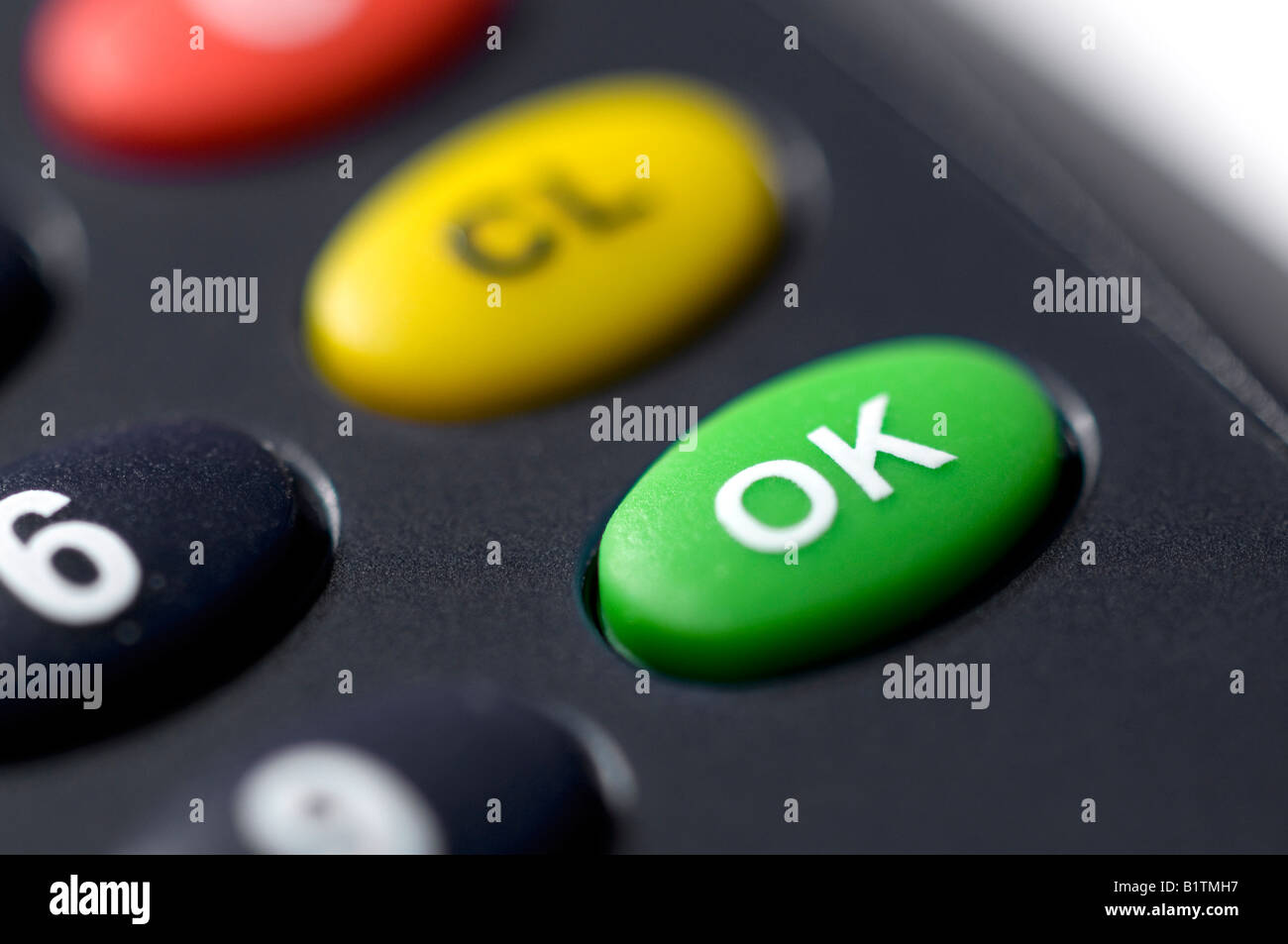 green ok button on remote control device Stock Photo - Alamy