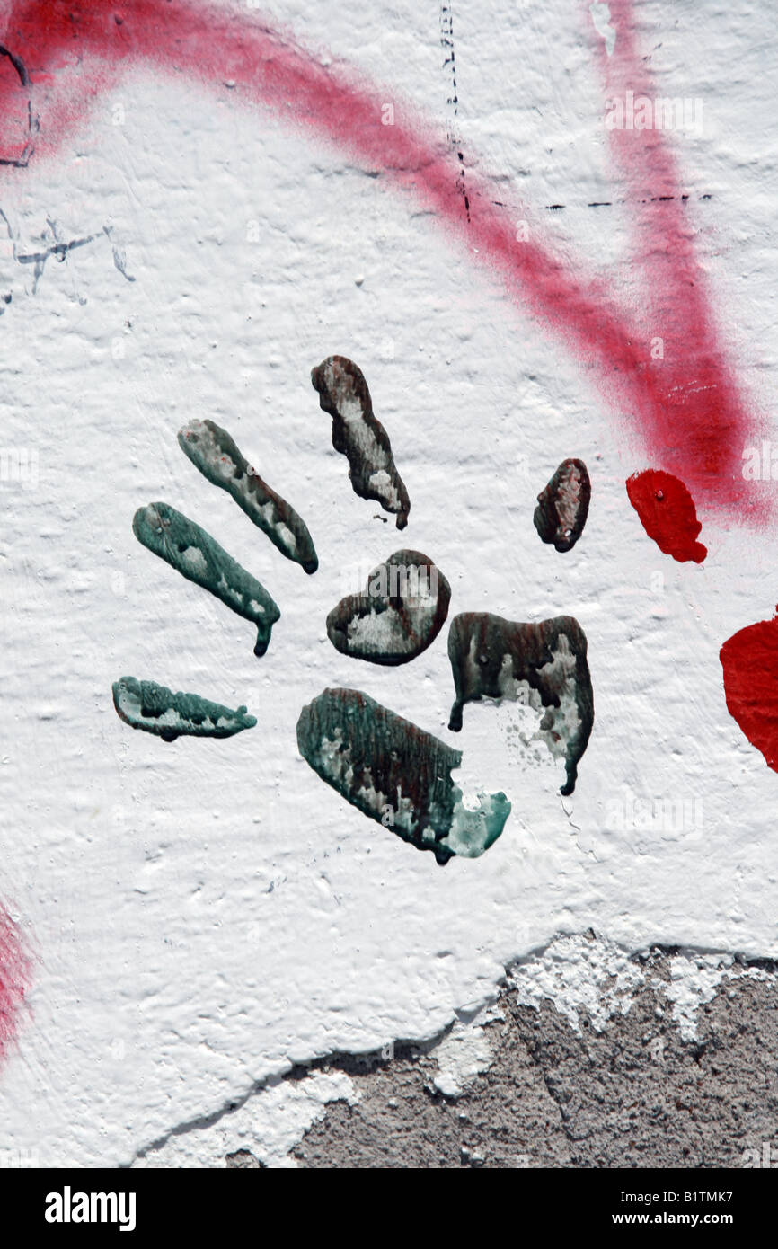 hand print painted graffiti on wall in town Stock Photo - Alamy