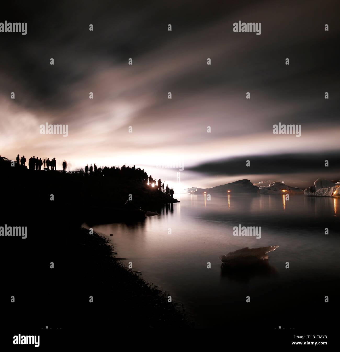 People on hill watching candles burning on Jokulsarlon Glacial Lagoon ...