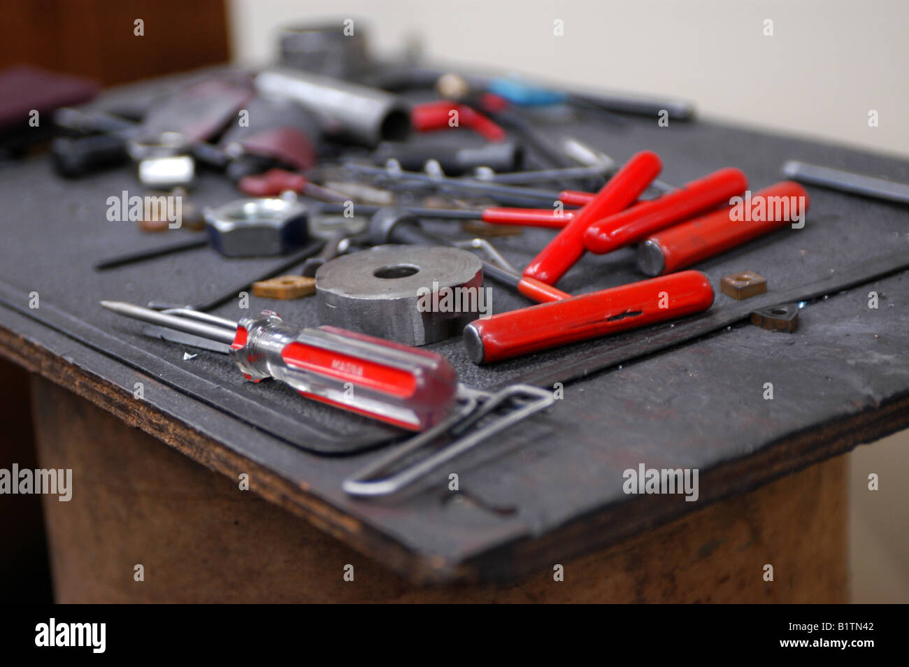 Work table in a factory Stock Photo - Alamy