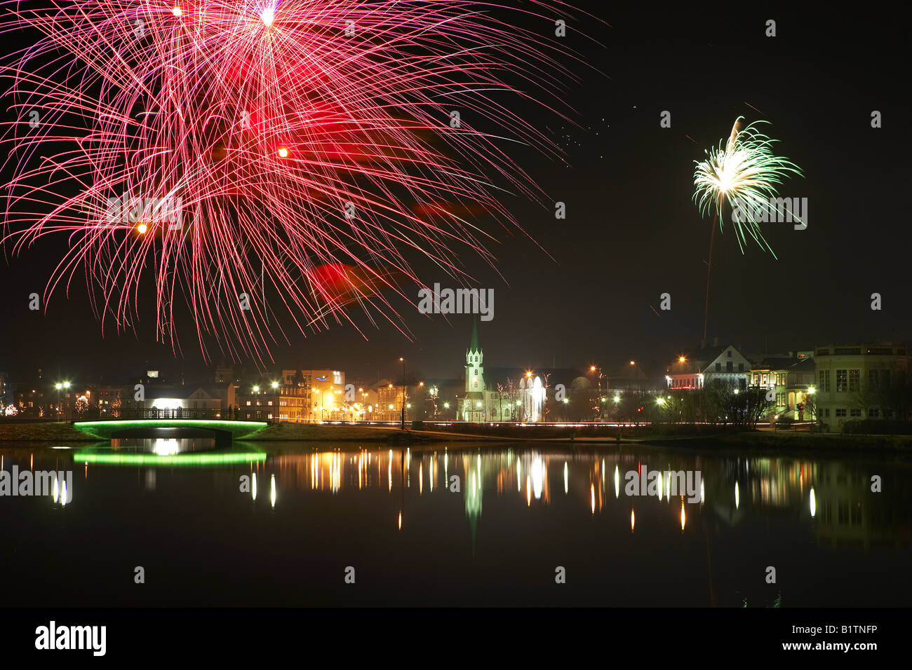 Fireworks Over Lake Tjornin, Reykjavik Iceland Stock Photo - Alamy