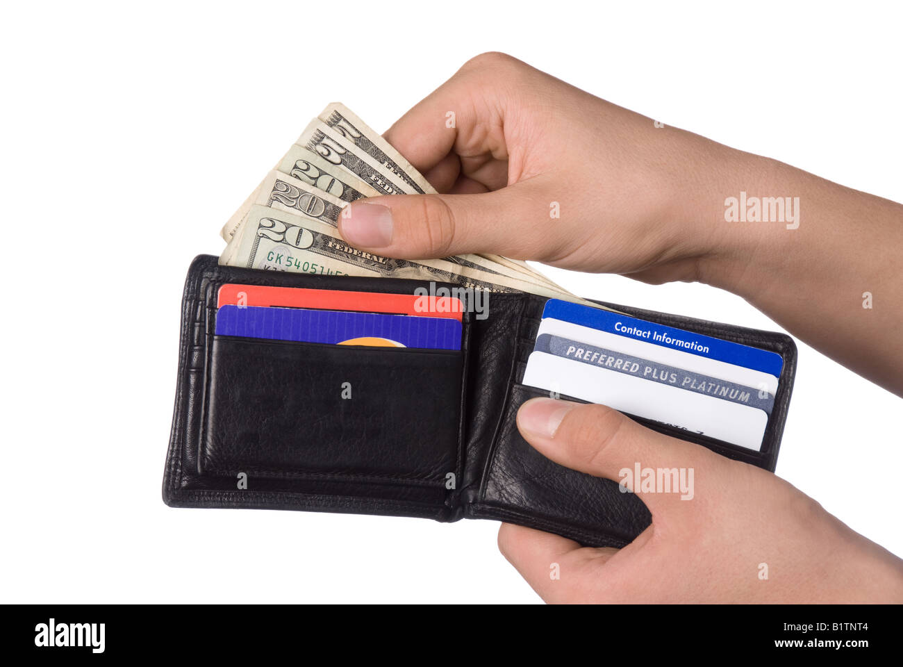 Dishing out cash from a leather wallet to pay bills Stock Photo - Alamy