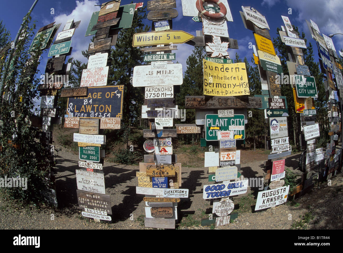 Sign posts along Alaska Highway at Watson Lake, Yukon Stock Photo - Alamy