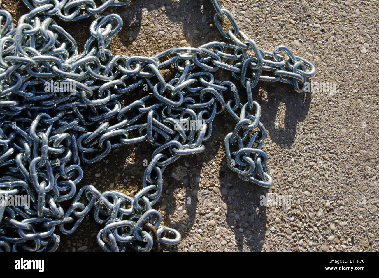 detail of metal chain on floor outdoors Stock Photo - Alamy