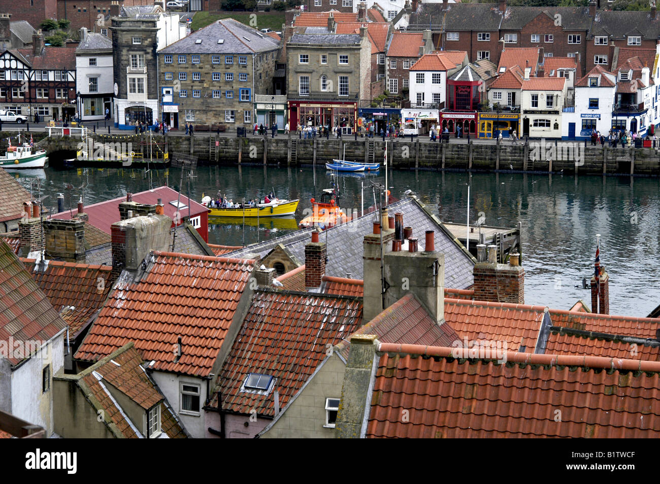 Fishing Boats, houses and the harbour, Whitby Harbour, North Yorkshire ...