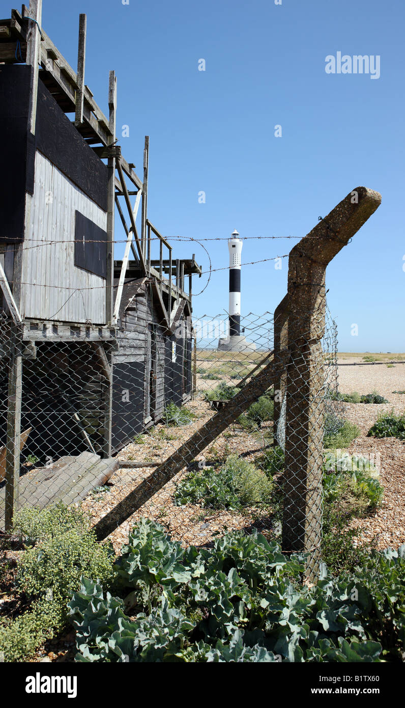 Desserted old shack, on a shingle beach on the south west coast of ...