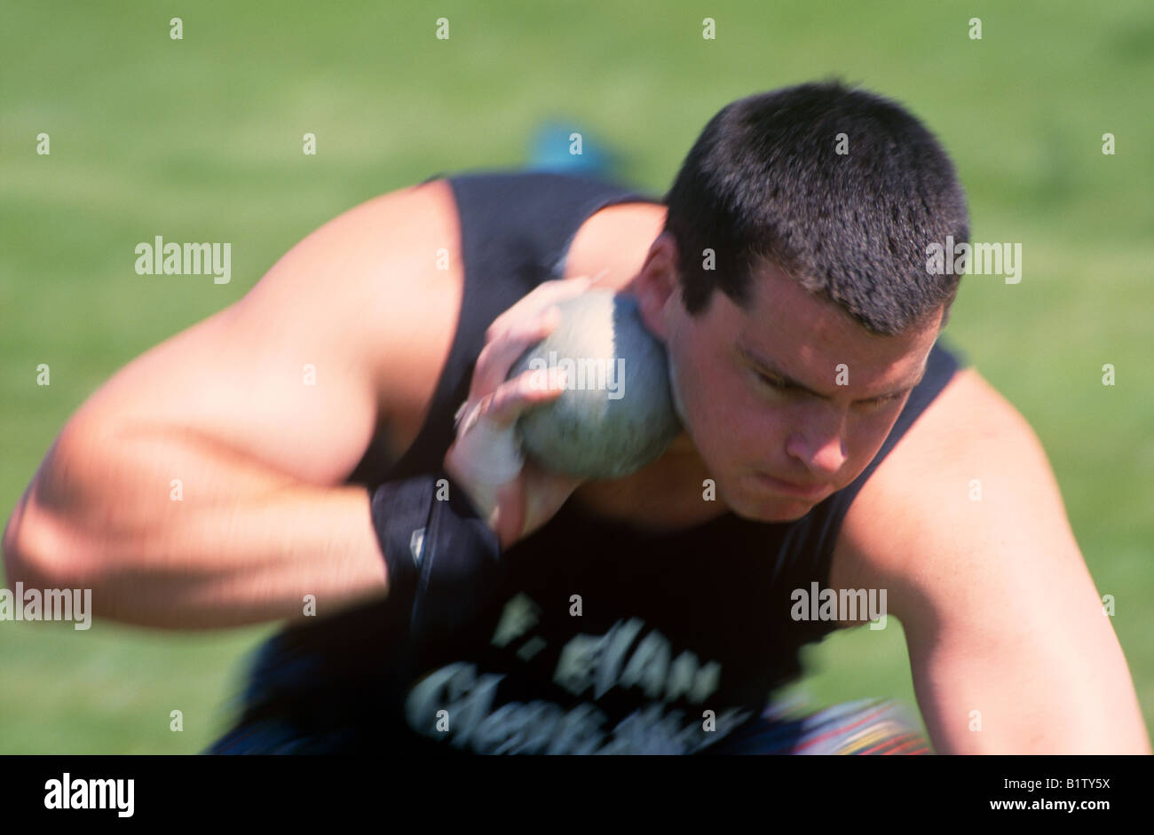 Shot put contestant at a traditional Scottish Highland games event ...