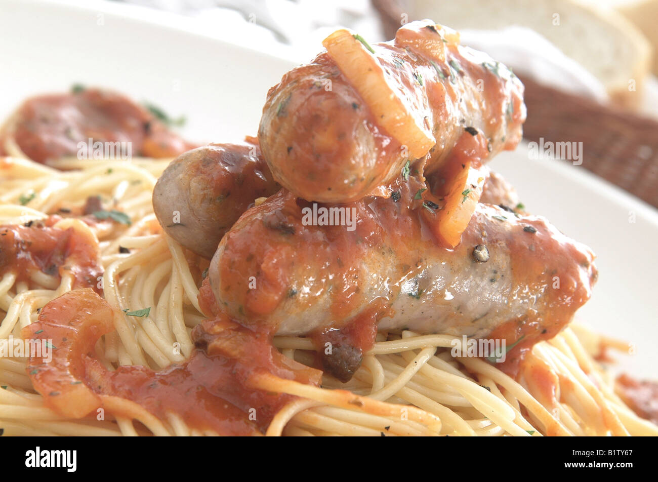 sausage cacciatore and spaghetti Stock Photo - Alamy