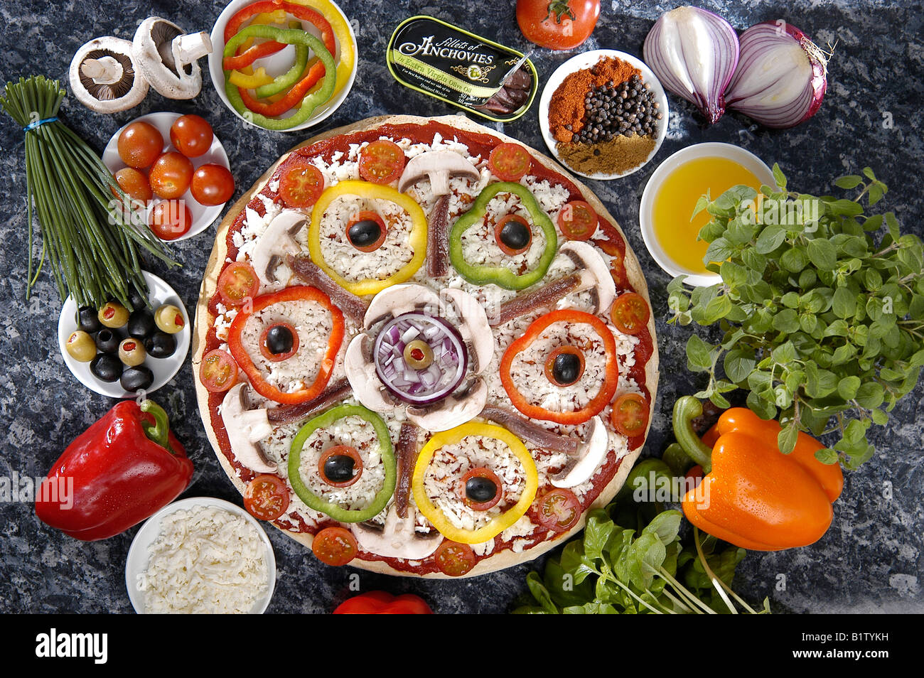 overhead view of a pizza and ingredients Stock Photo - Alamy
