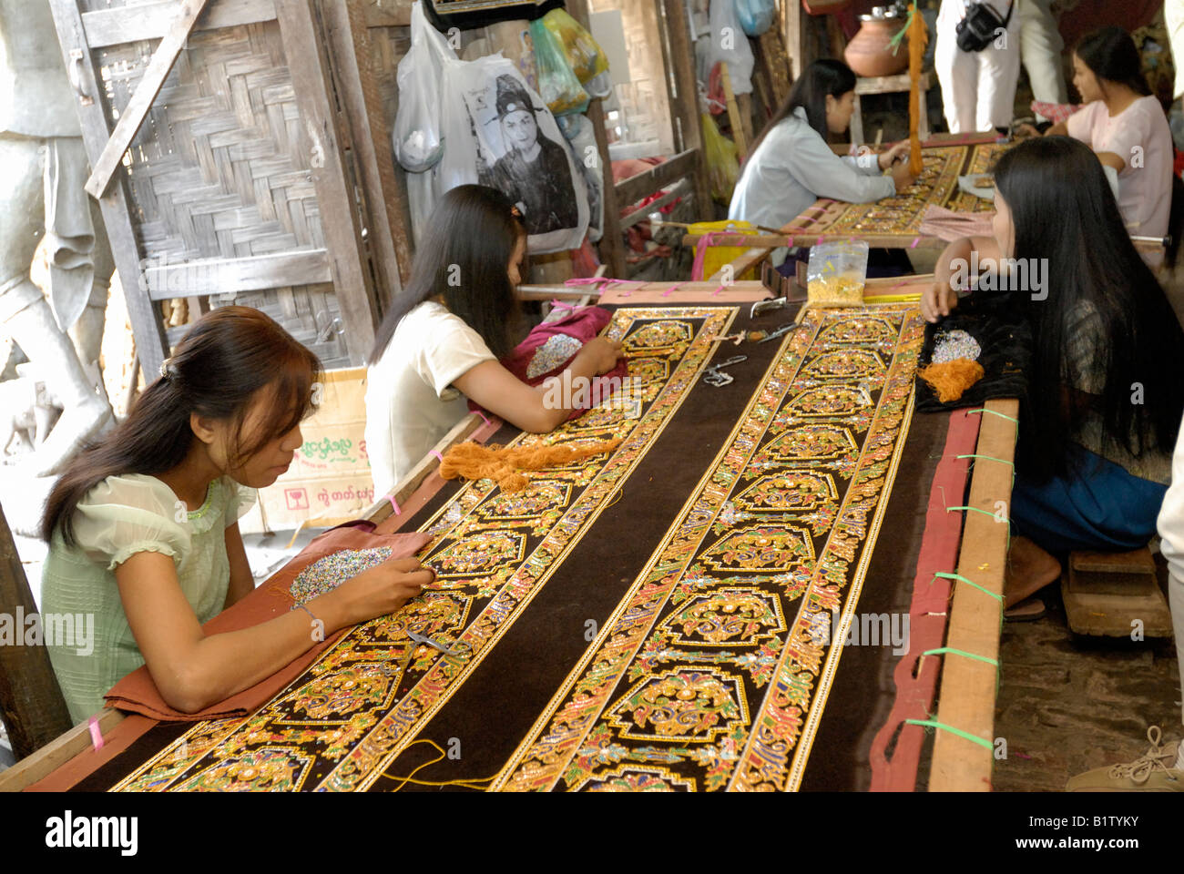 women stitching tapestries in a workshop of tapestry marionettes and ...