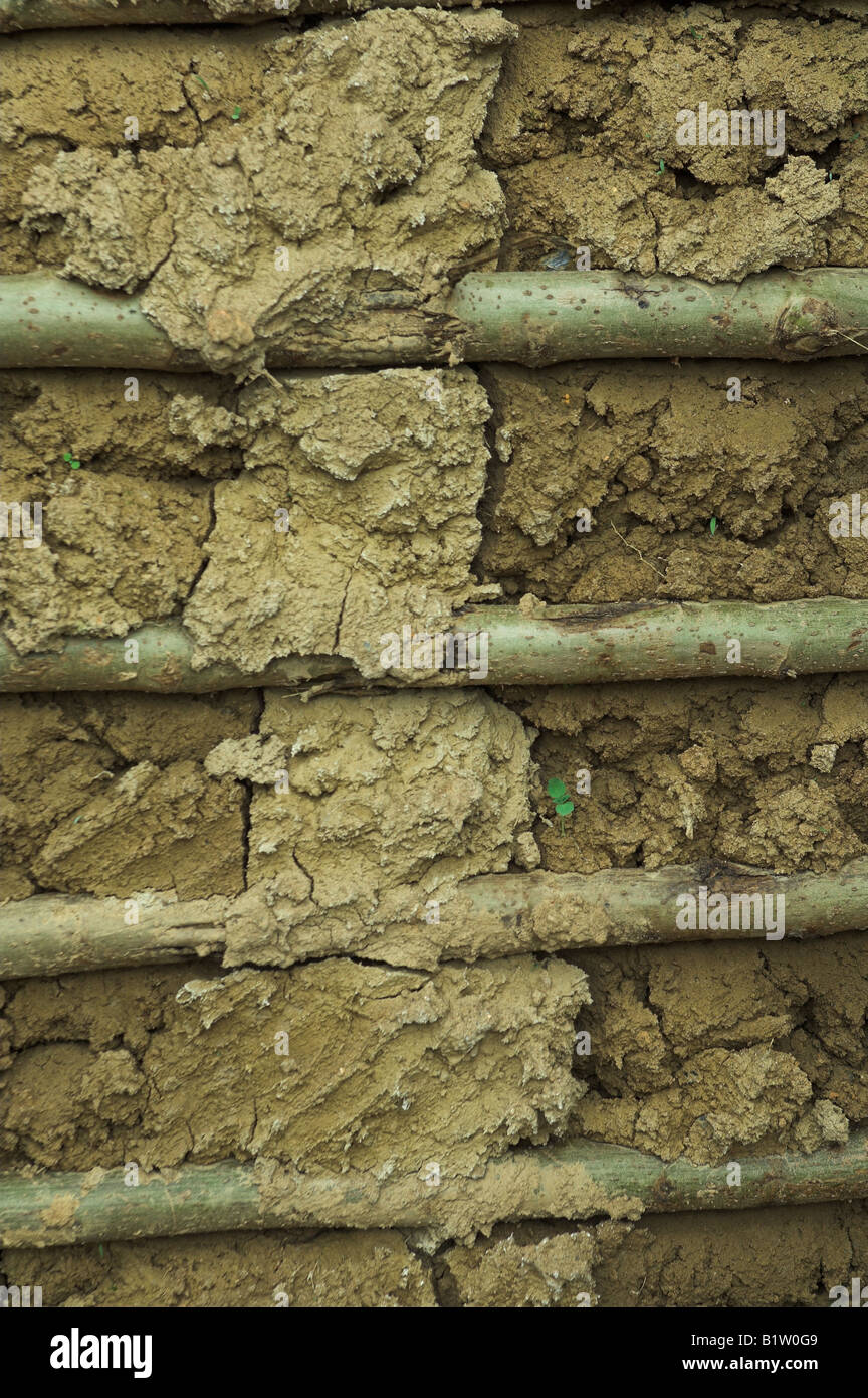 Detail of mud hut wall showing baked mud and wooden supports Kenya ...