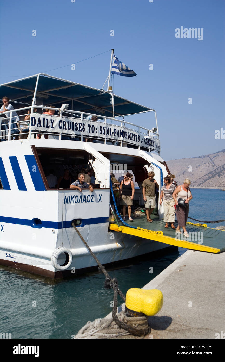 Tourists disembarking Symi, Rhodes Greece Stock Photo - Alamy