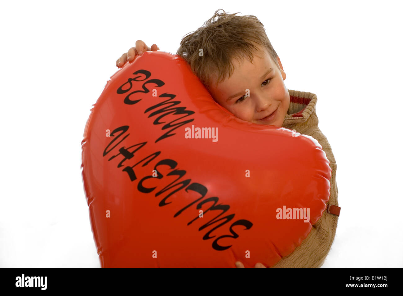 little 5 year old holding a valentine heart Stock Photo - Alamy