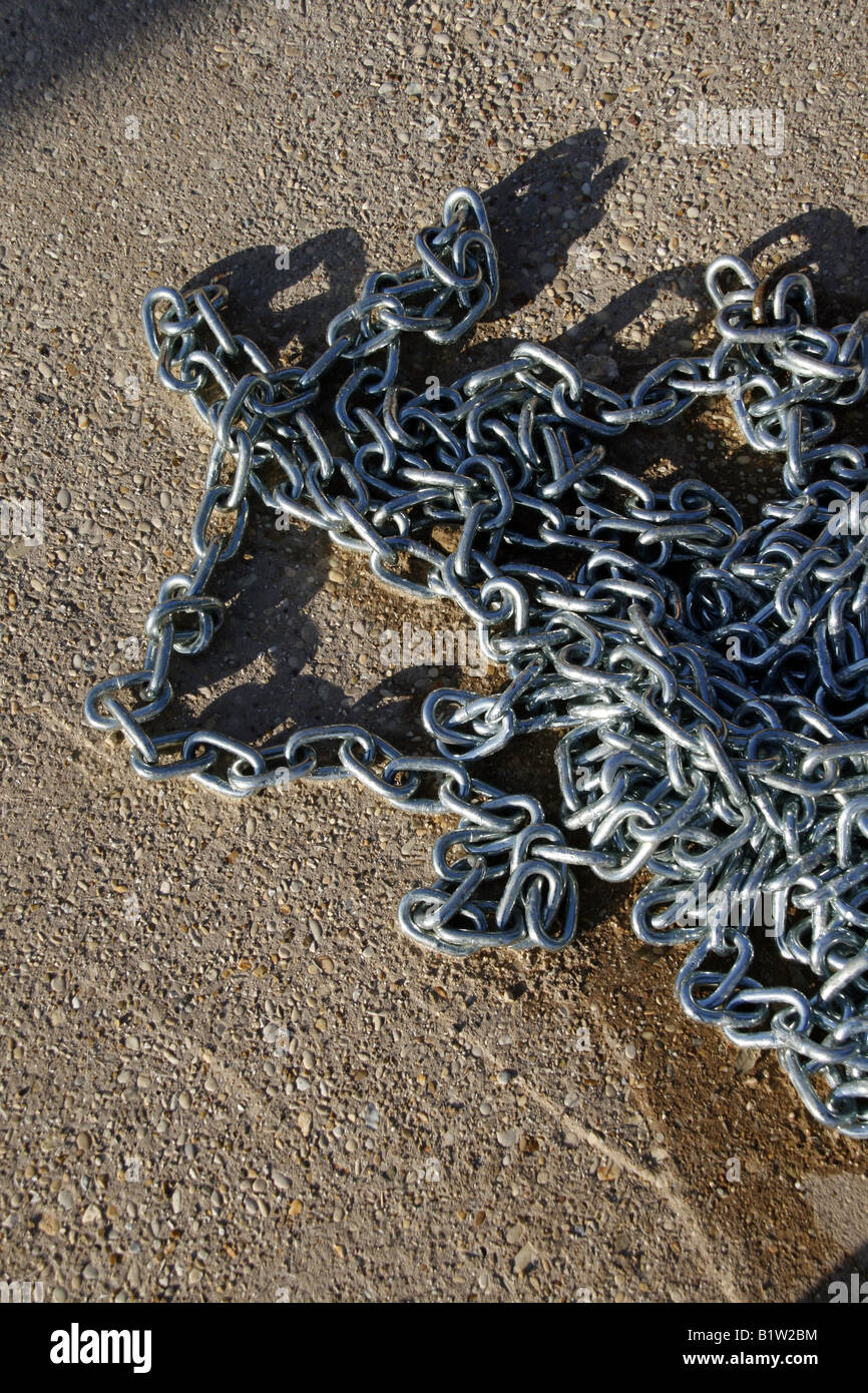 detail of metal chain on floor outdoors Stock Photo - Alamy
