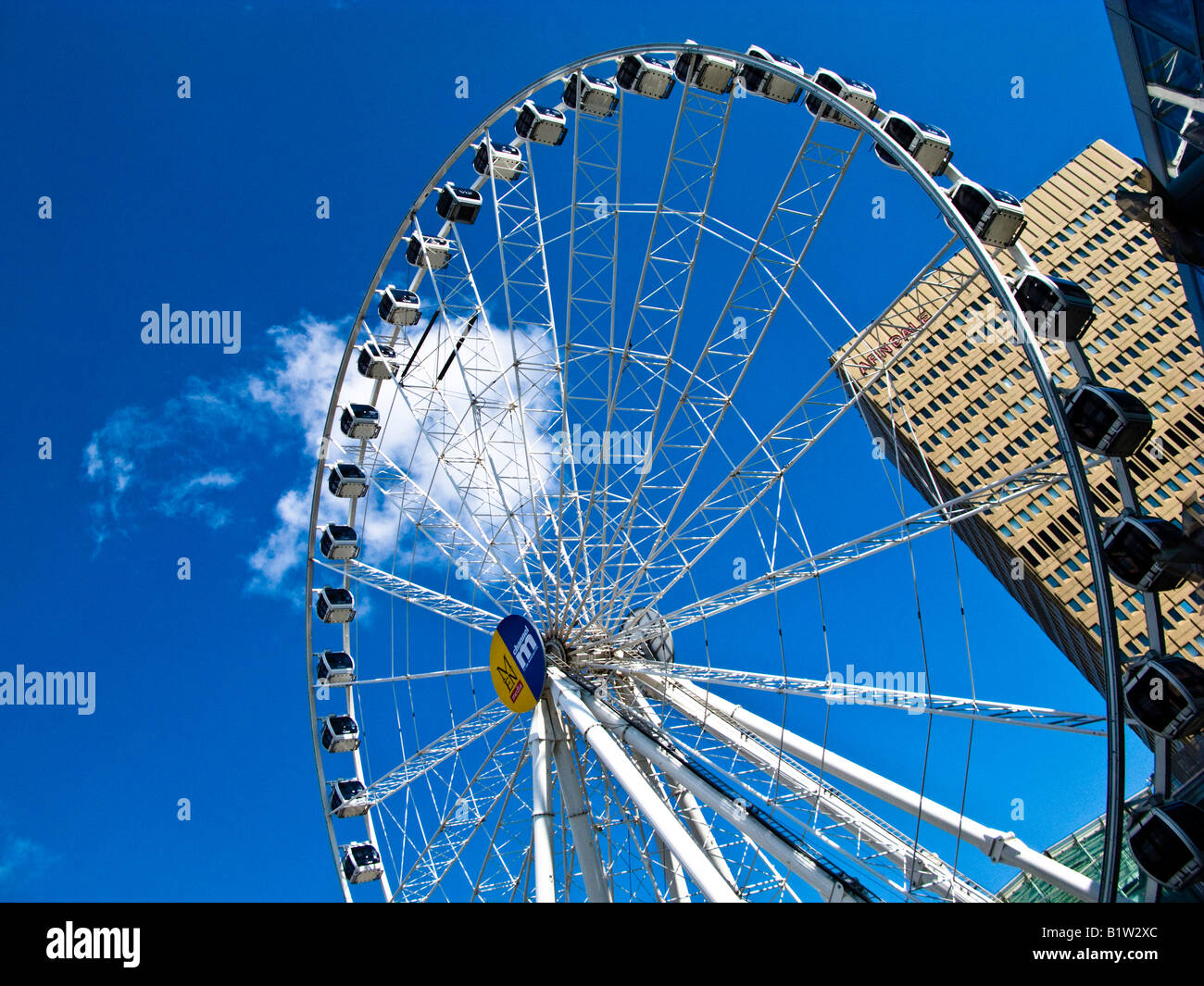 Manchester wheel with Arndale tower in background Stock Photo - Alamy