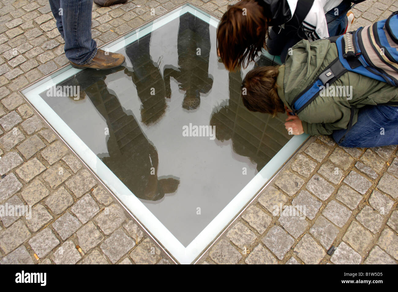students surround glass plate commemorating the burning of the books by ...