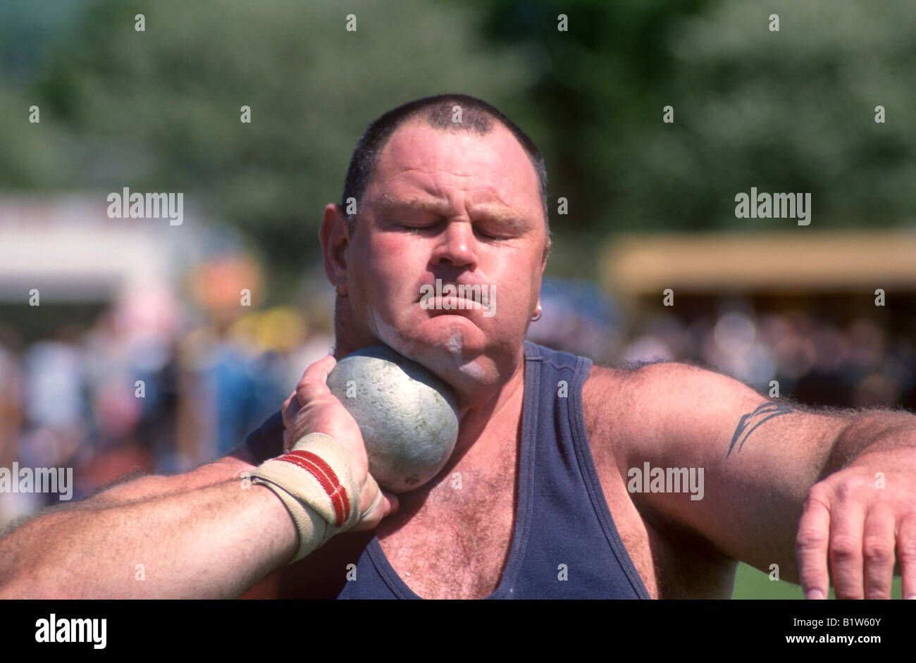 Shot put contestant at a traditional Scottish Highland games event ...