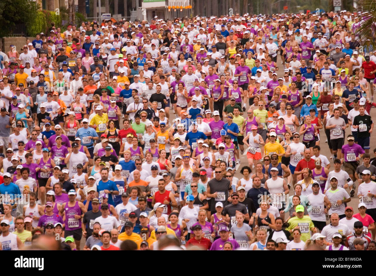 Thousands of participants at the start begin the 26 mile run of a ...