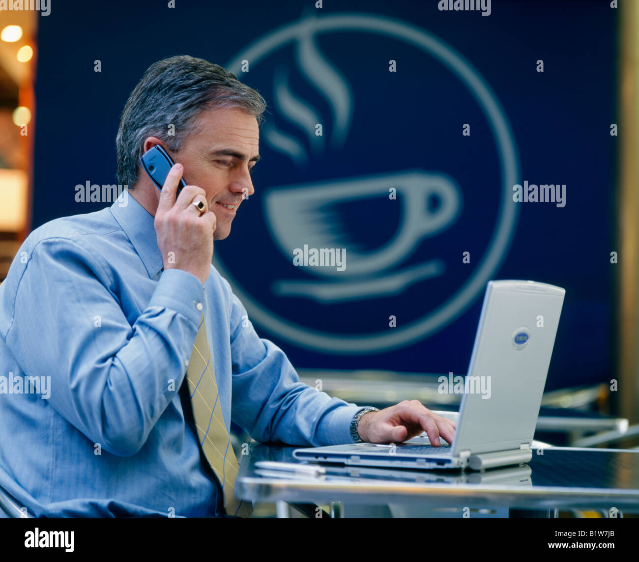 man with laptop computer in cafe Stock Photo - Alamy