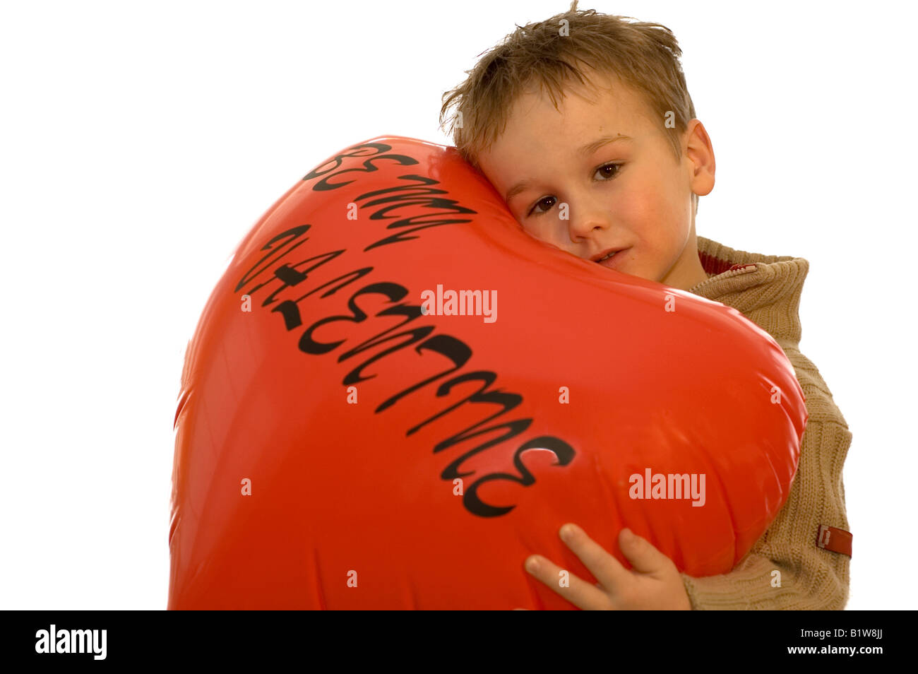 little 5 year old holding a valentine heart Stock Photo - Alamy