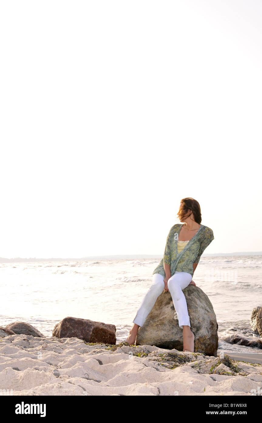 young woman 24 relaxing at beach, backlight chillout backlight brunette ...