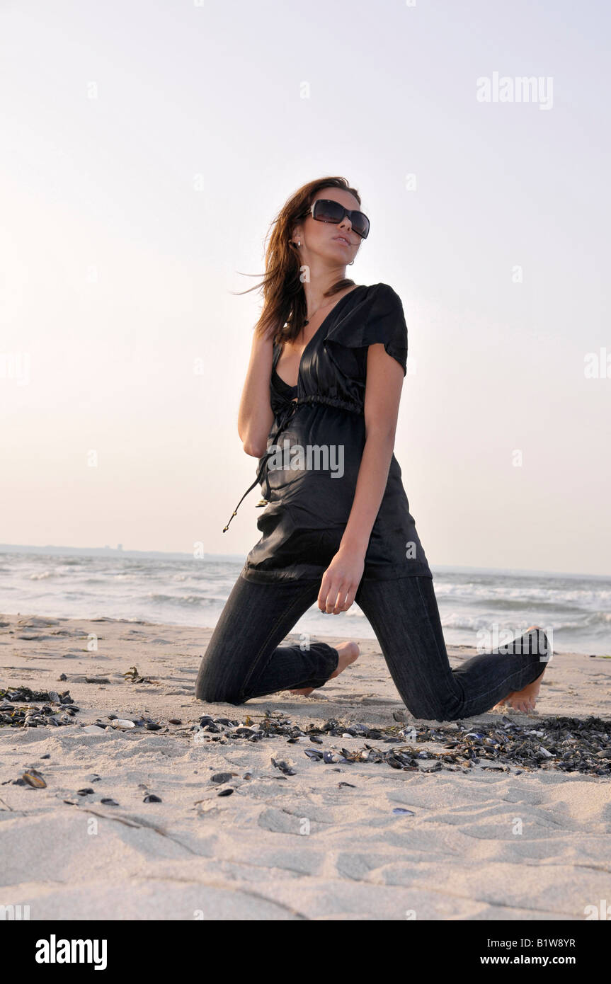 young woman 24 posing at beach, backlight chillout backlight brunette ...