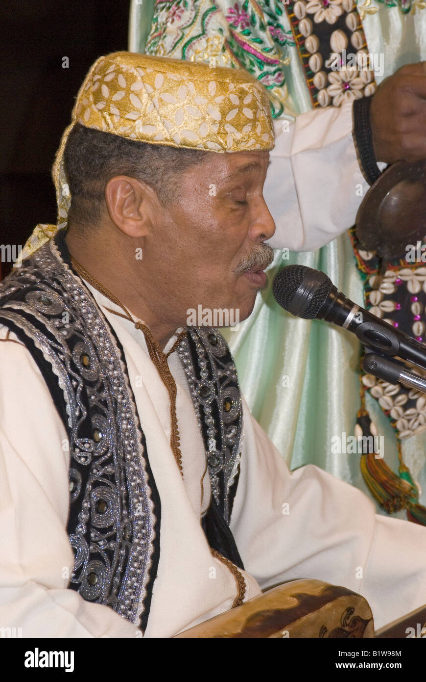 Moroccan musician ith traditional costume playing in a restaurant of ...