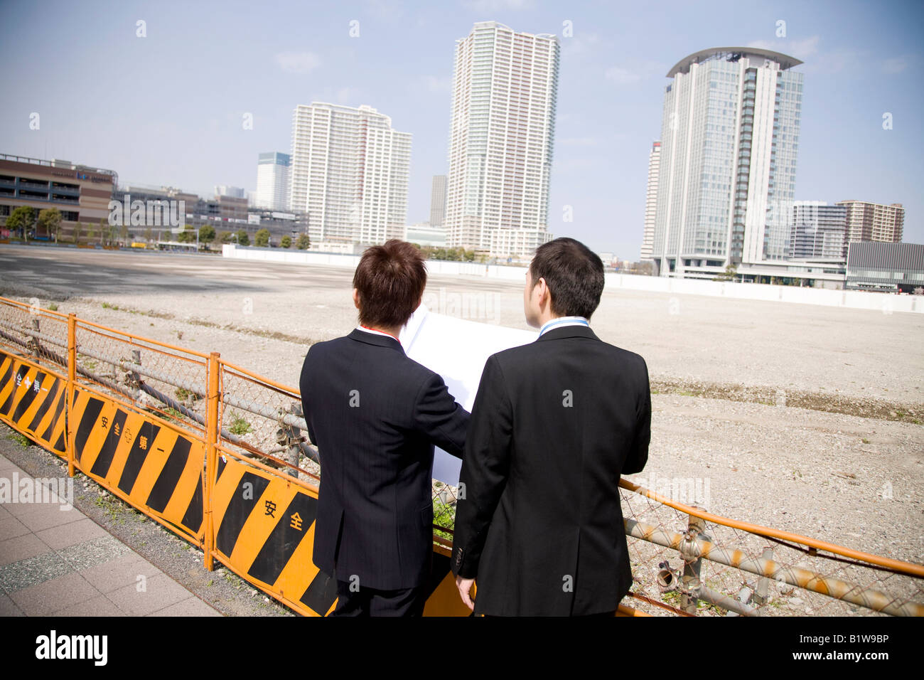 Back figure of Japanese workers Stock Photo - Alamy