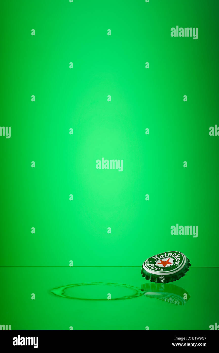 Cap of an Heineken beer still life on green Serie of 3 photos Stock ...