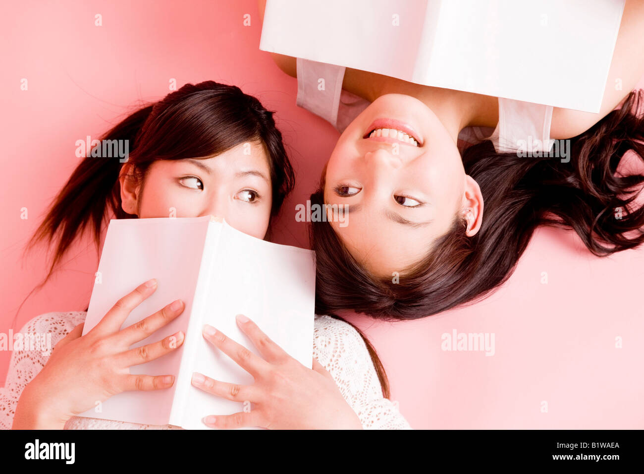 Japanese young women reading a book Stock Photo - Alamy
