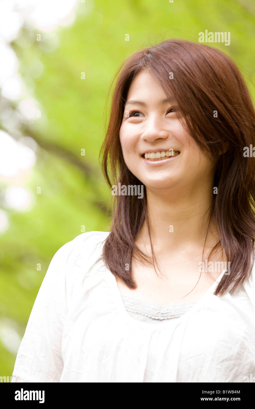 Smiling Japanese young woman Stock Photo - Alamy