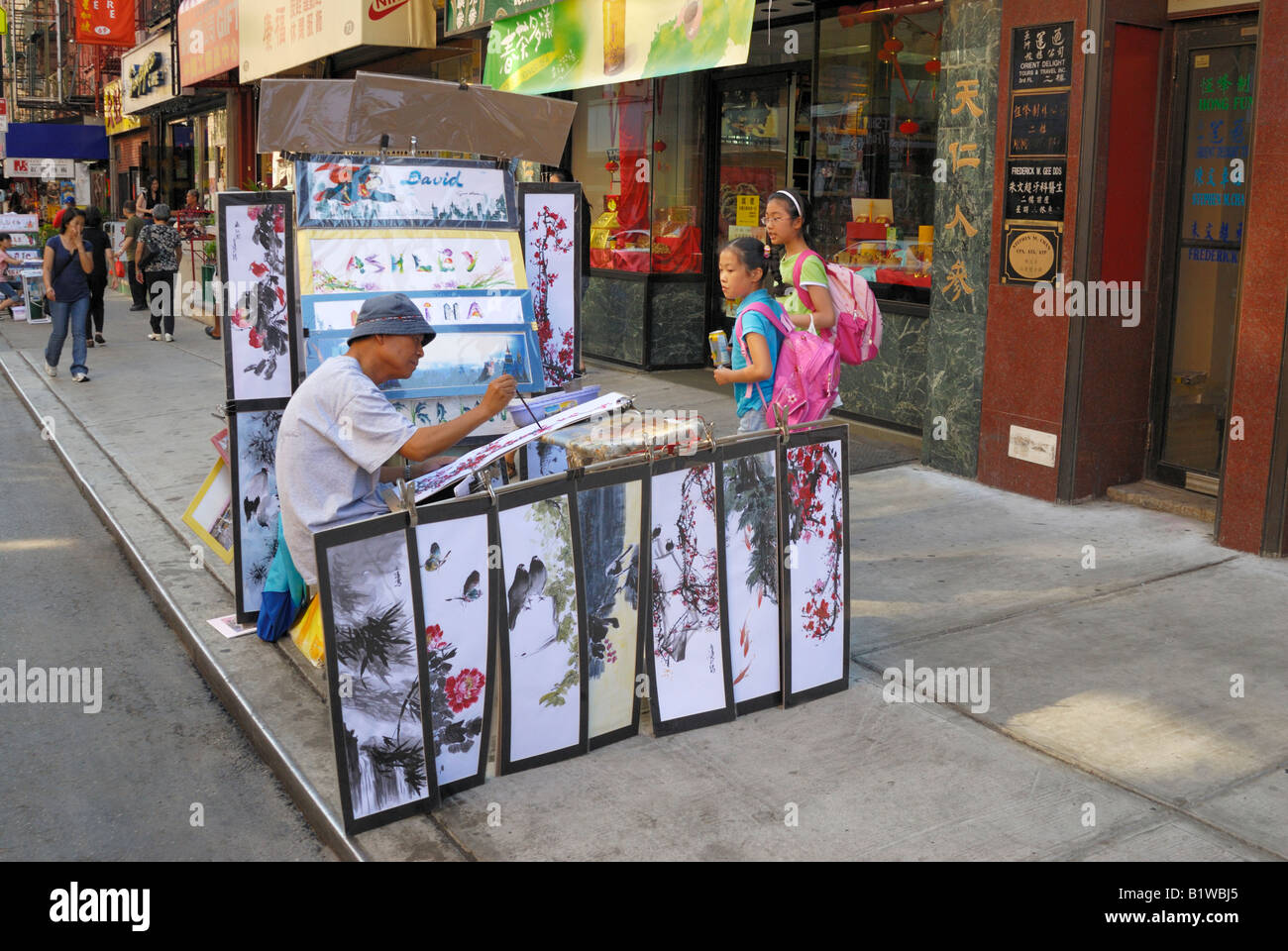 An artist on Mott Street in Chinatown New York paints traditional ...