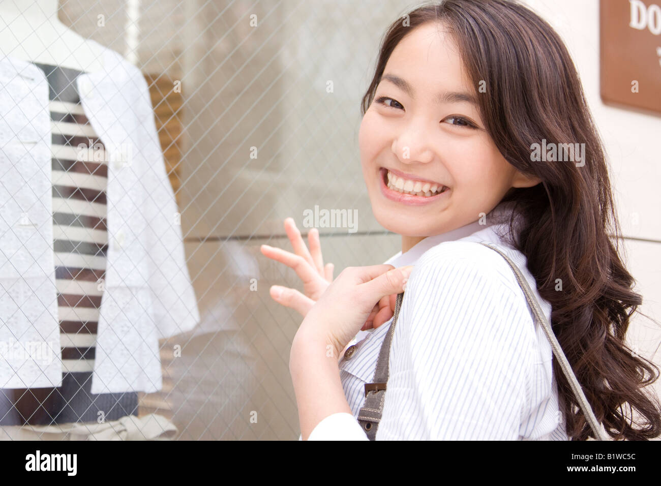 Japanese young woman enjoy window-shopping Stock Photo - Alamy