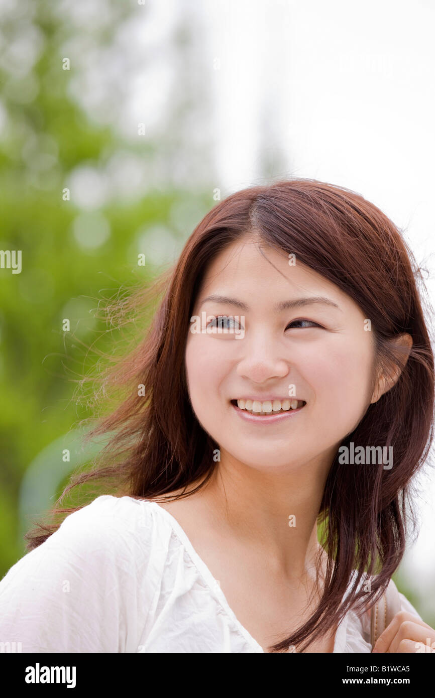 Smiling Japanese young woman Stock Photo - Alamy