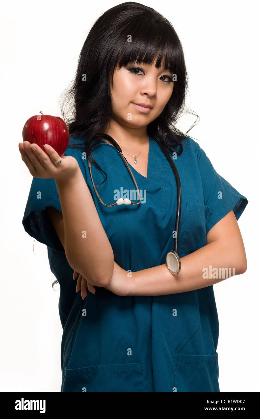 Asian nurse with apple Stock Photo - Alamy