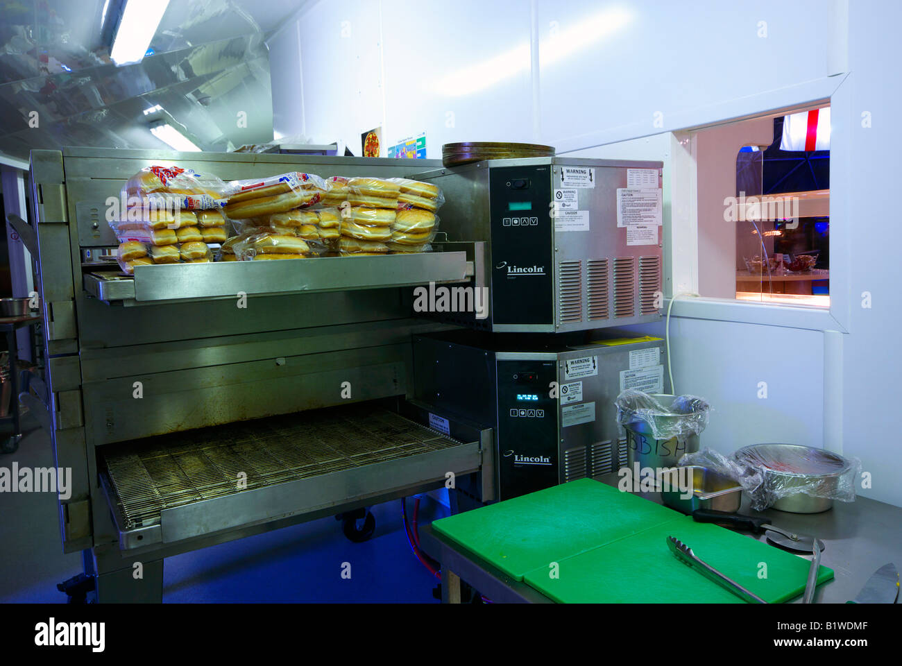 Commercial Burger bun cooker grill Stock Photo - Alamy