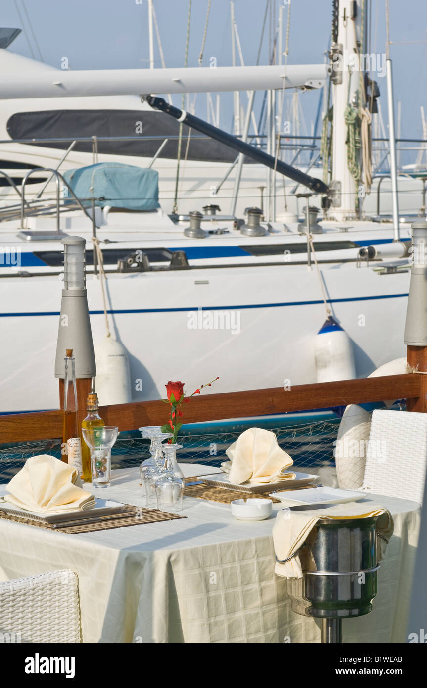 A table set up ready for dinner at an exclusive waterside restauarant ...