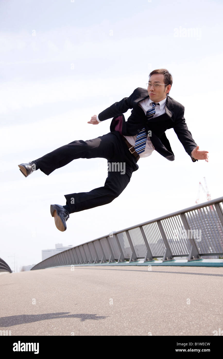 Japanese office worker jumping lively Stock Photo - Alamy
