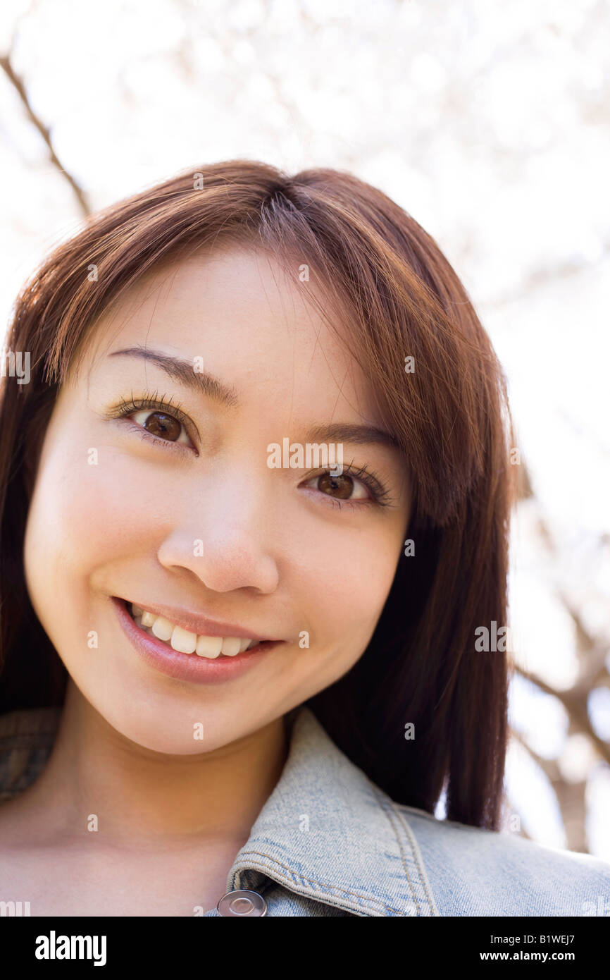 Smiling Japanese young woman Stock Photo - Alamy