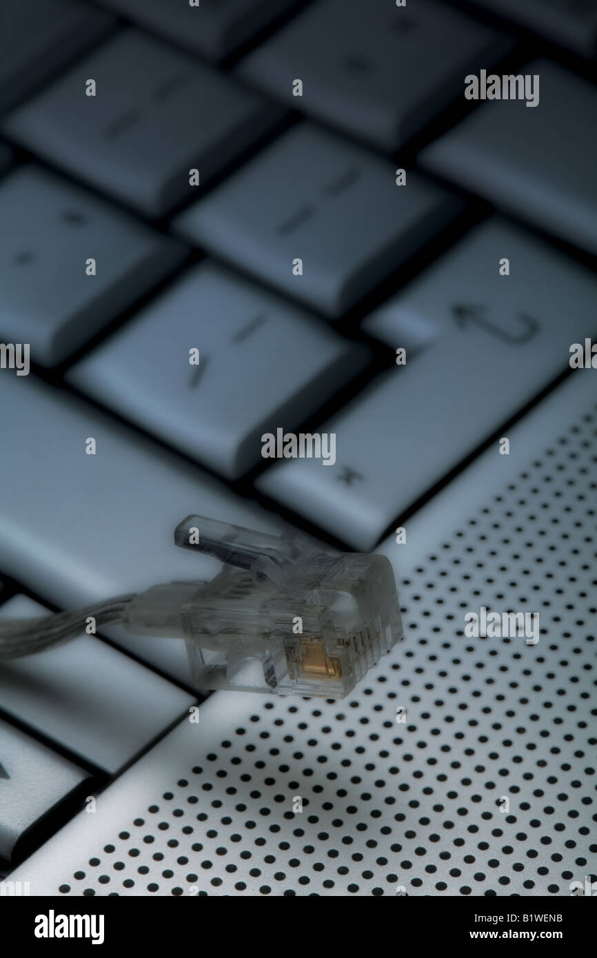Laptop keyboard with featured network cable Stock Photo - Alamy
