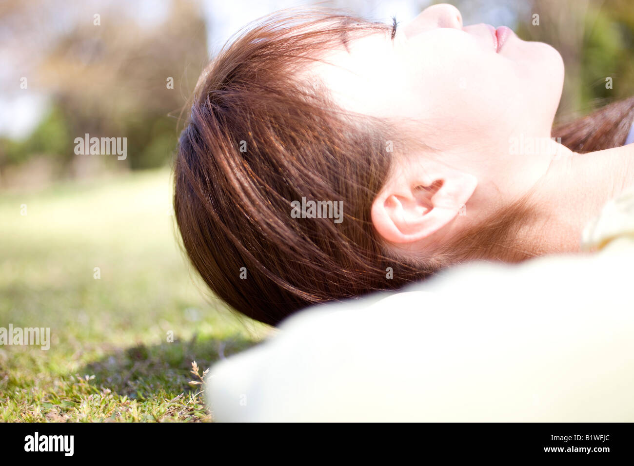 Japanese young woman napping on the ground Stock Photo - Alamy