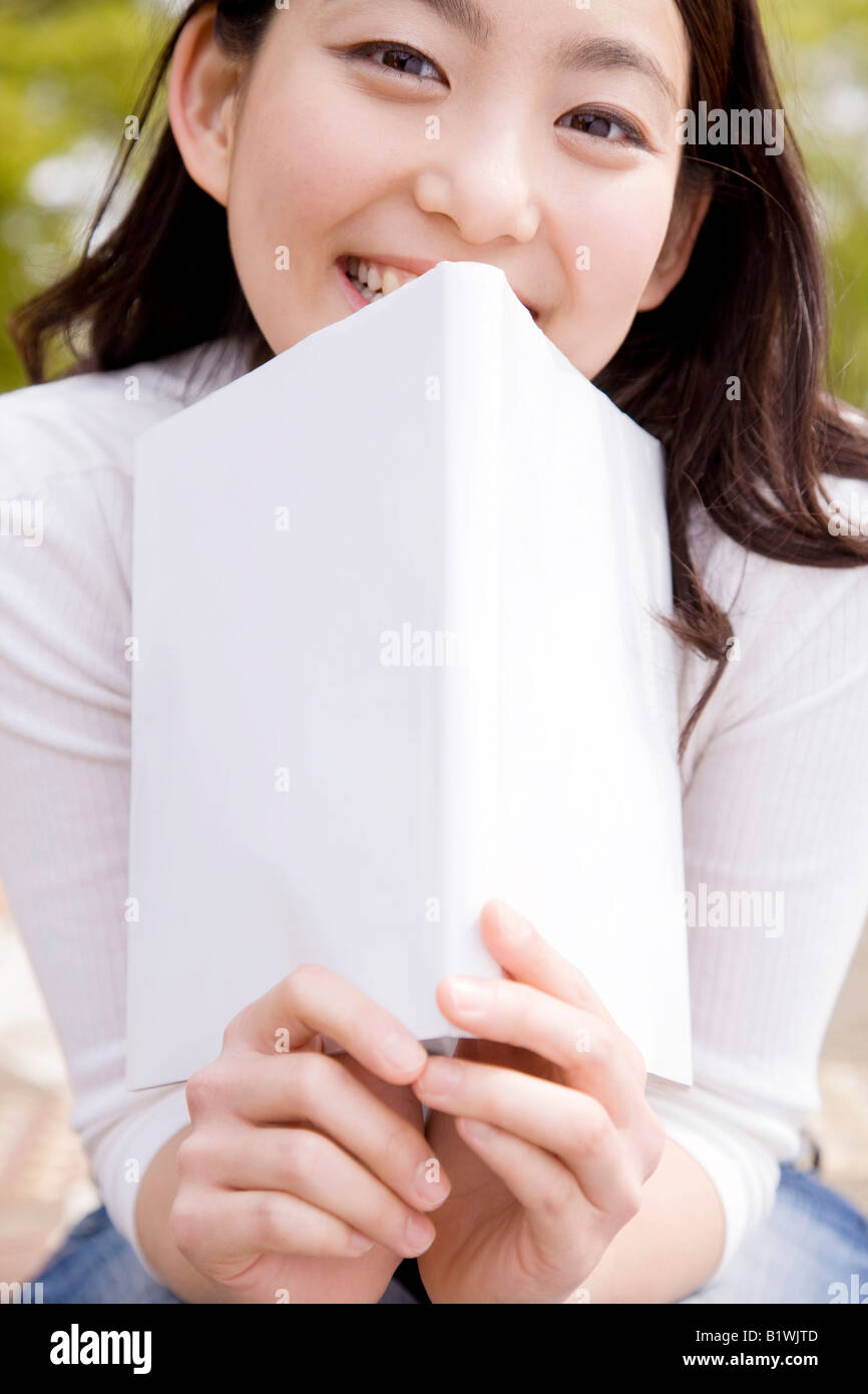 Japanese young woman reading a book Stock Photo - Alamy