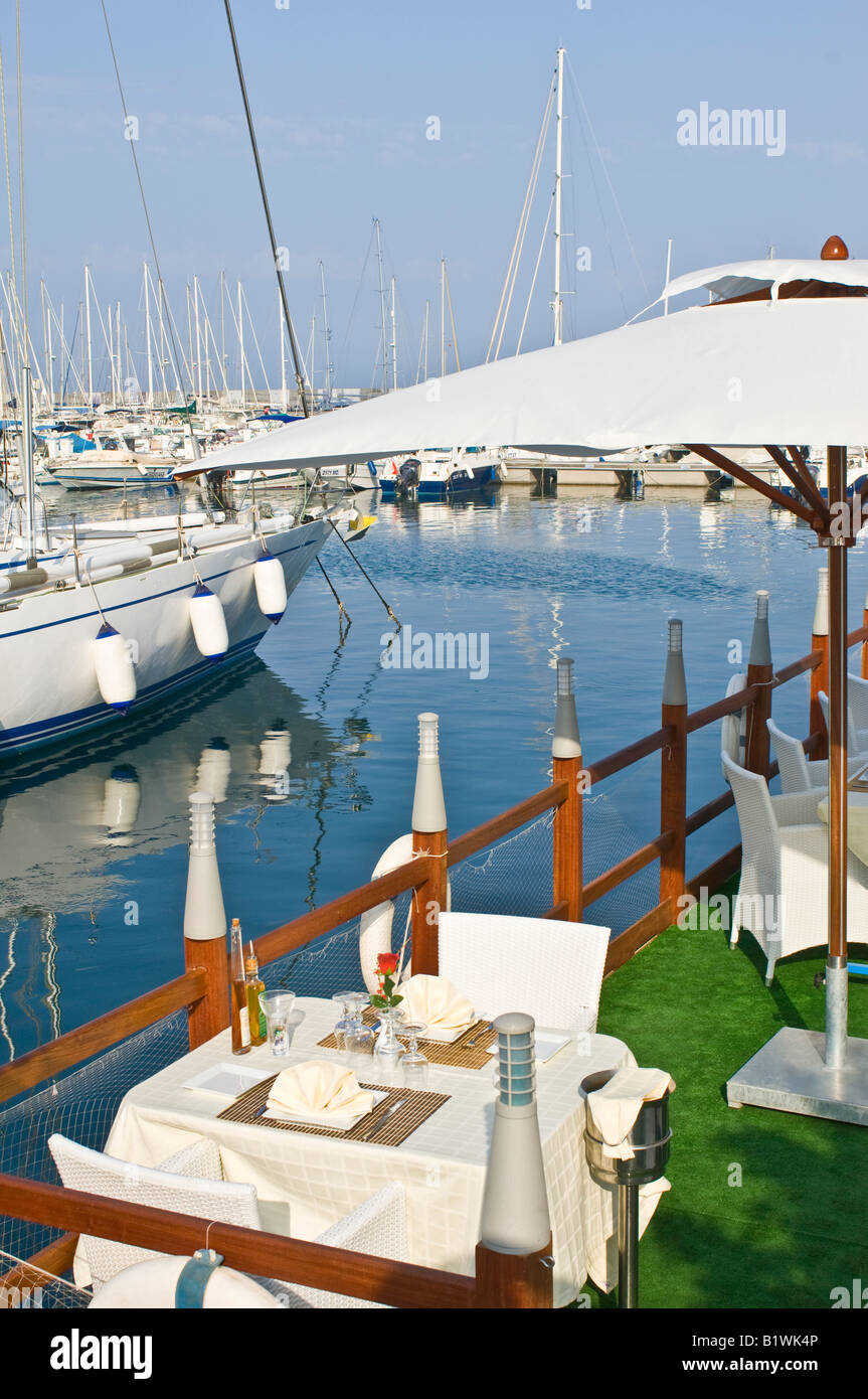 A table set up ready for dinner at an exclusive waterside restauarant ...