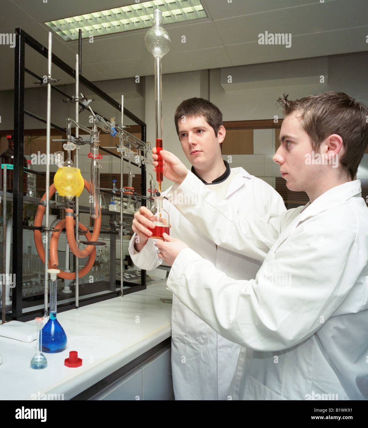 pharmacy students in laboratory experiment Stock Photo - Alamy