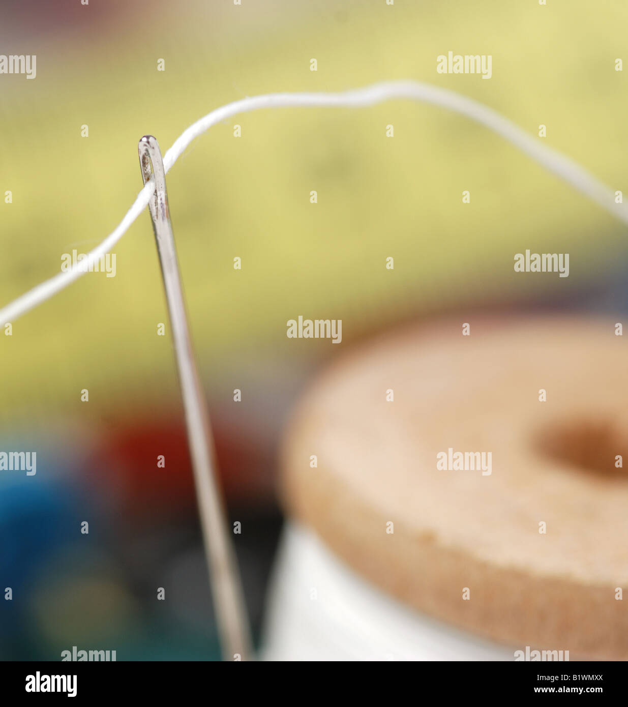 Needle and a thread A set of accessories for sewing Stock Photo - Alamy